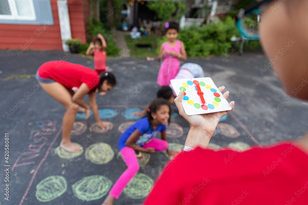 Kids outside playing summer games in the driveway Stock Photo | Adobe Stock