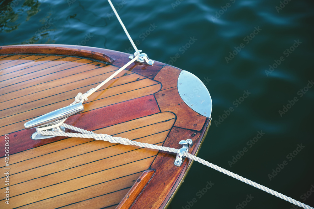 Vintage wooden boat with mooring ropes Stock Photo | Adobe Stock