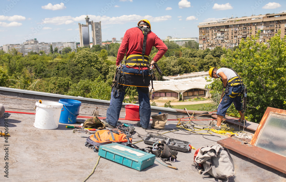 Working at elevations. Rope access, high-altitude outdoor work. Stock ...