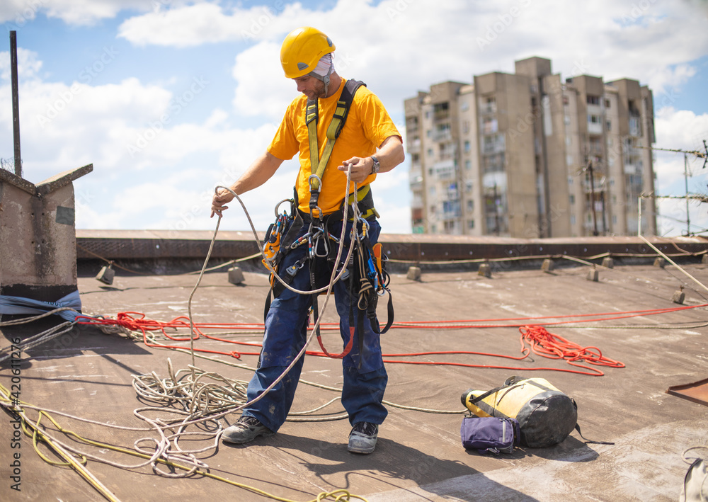 Working at elevations. Rope access, high-altitude outdoor work. Stock ...