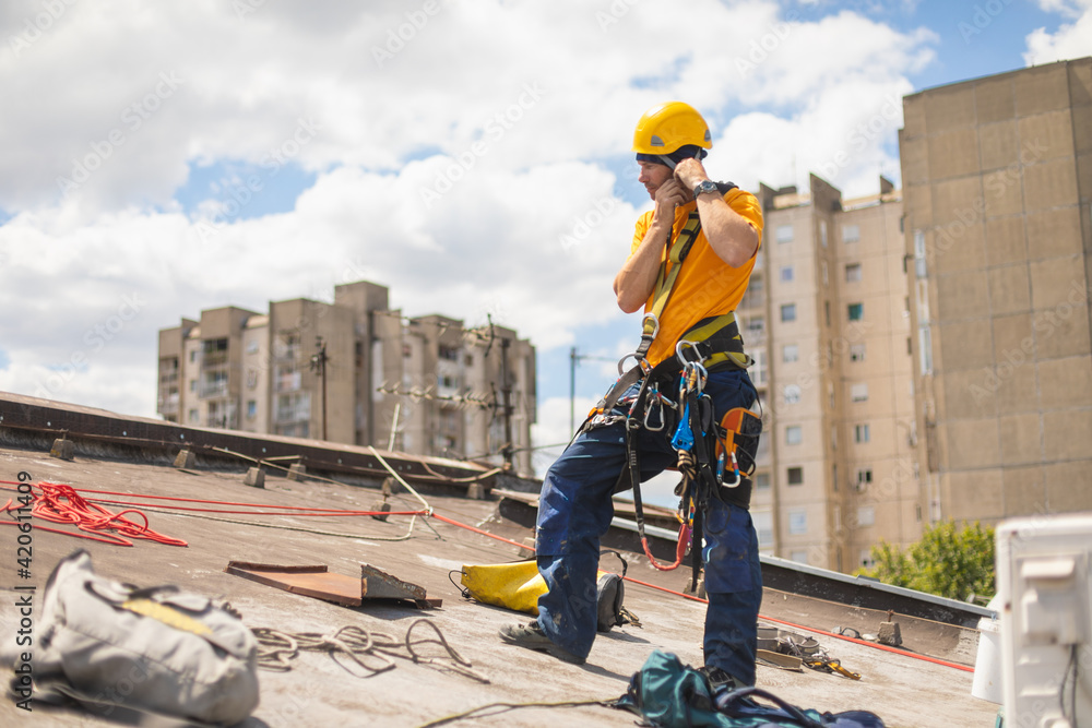Working at elevations. Rope access, high-altitude outdoor work. Stock ...