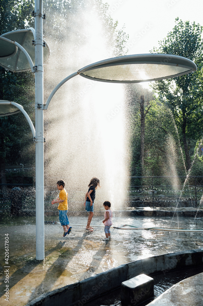 Children playing with water Stock Photo | Adobe Stock