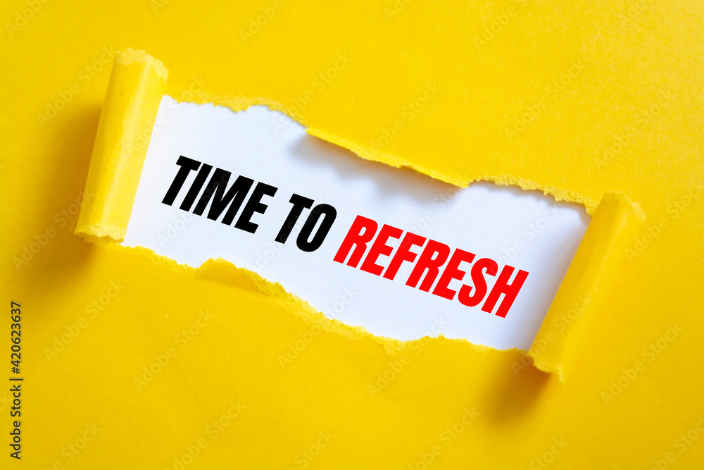 TIME TO REFRESH written under torn paper. Stock Photo | Adobe Stock