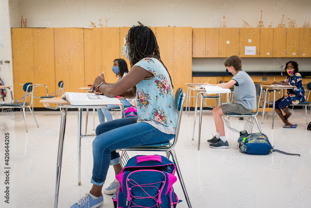 Kids in a reduced size class during COVID-19 Stock Photo | Adobe Stock