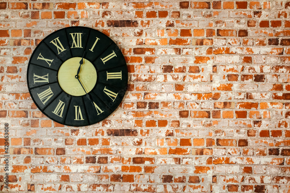 Clock on a wall Stock Photo | Adobe Stock