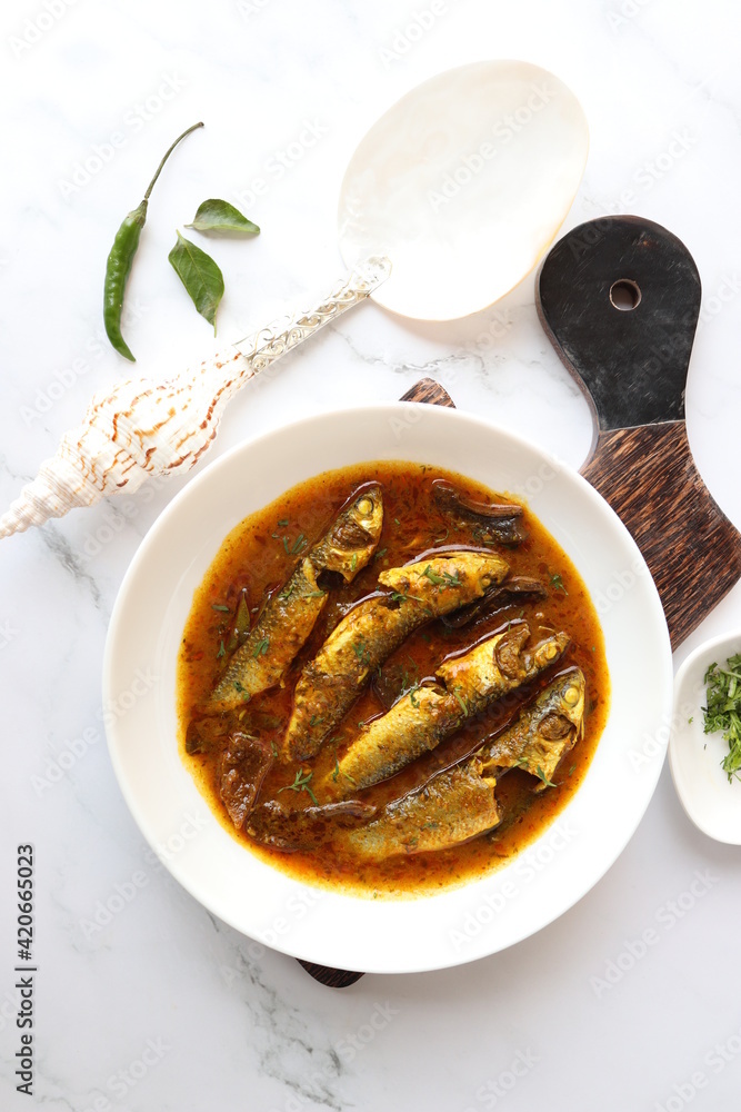Indian fish curry. White Mullet fish curry made with dried mango and ...