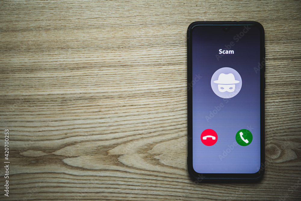 Incoming call from Scammer. Online scam on phone Stock Photo | Adobe Stock