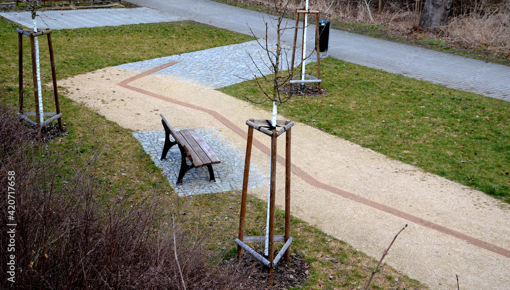 Newly introduced park beige gravel walkways, metal rusty corten steel ...