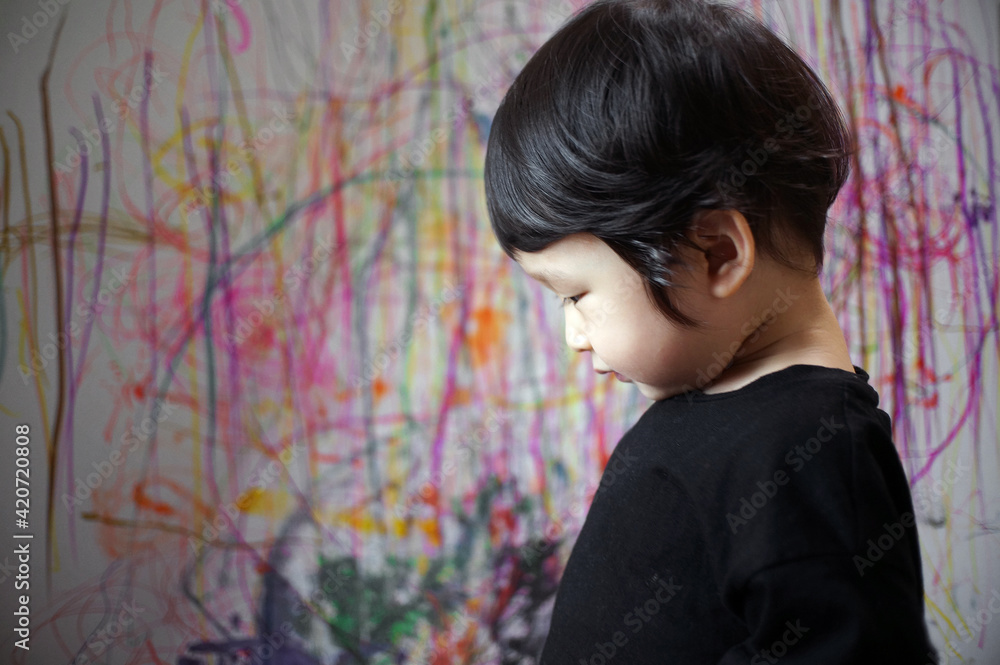 Cute Asian little boy drawing at home Stock Photo | Adobe Stock