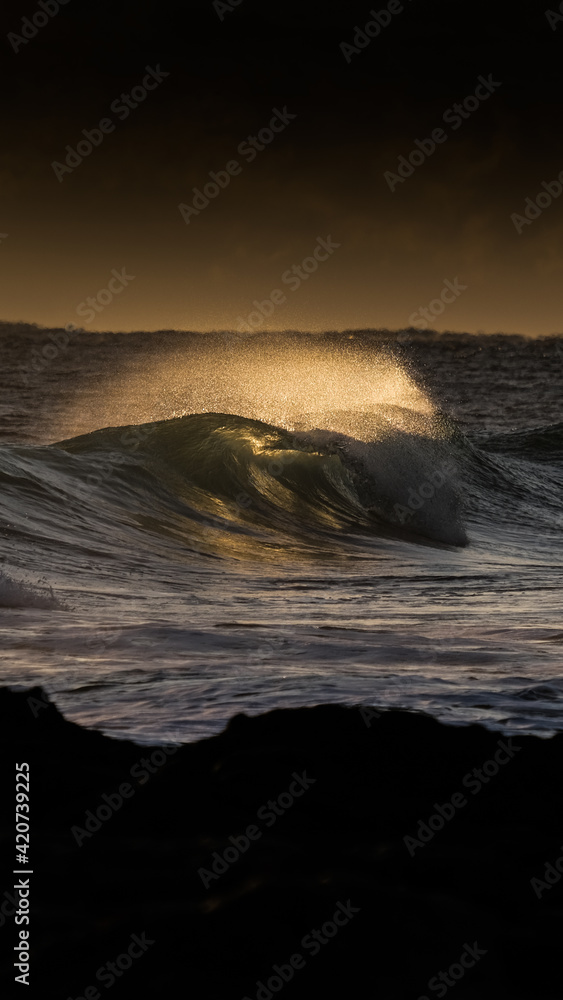 Wave during sunrise Stock Photo | Adobe Stock