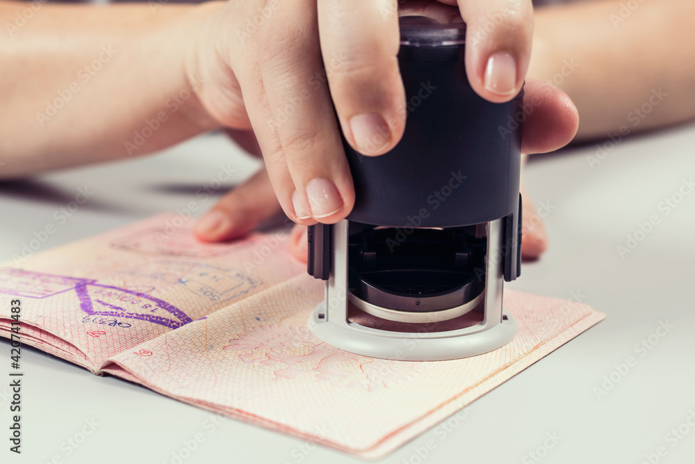 Foto de Immigration and passport control at the airport. woman border ...