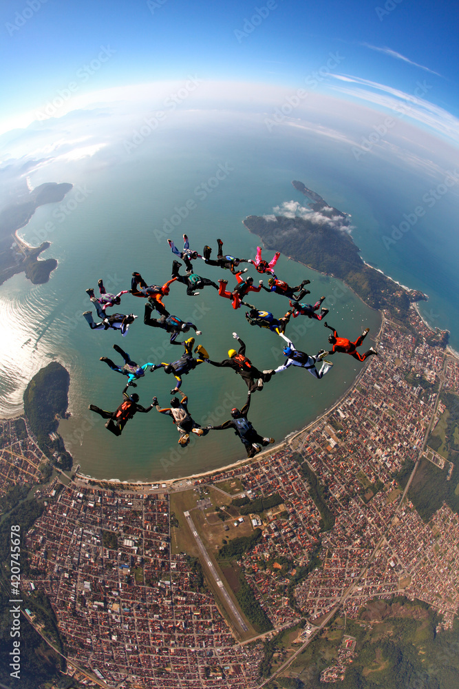 Skydiving big formation over the Brazilian beach Stock Photo | Adobe Stock
