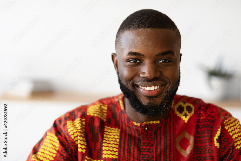 Closeup portrait of handsome positive black man in traditional african ...