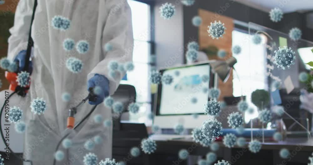 Multiple covid-19 cells floating against male health worker spraying ...
