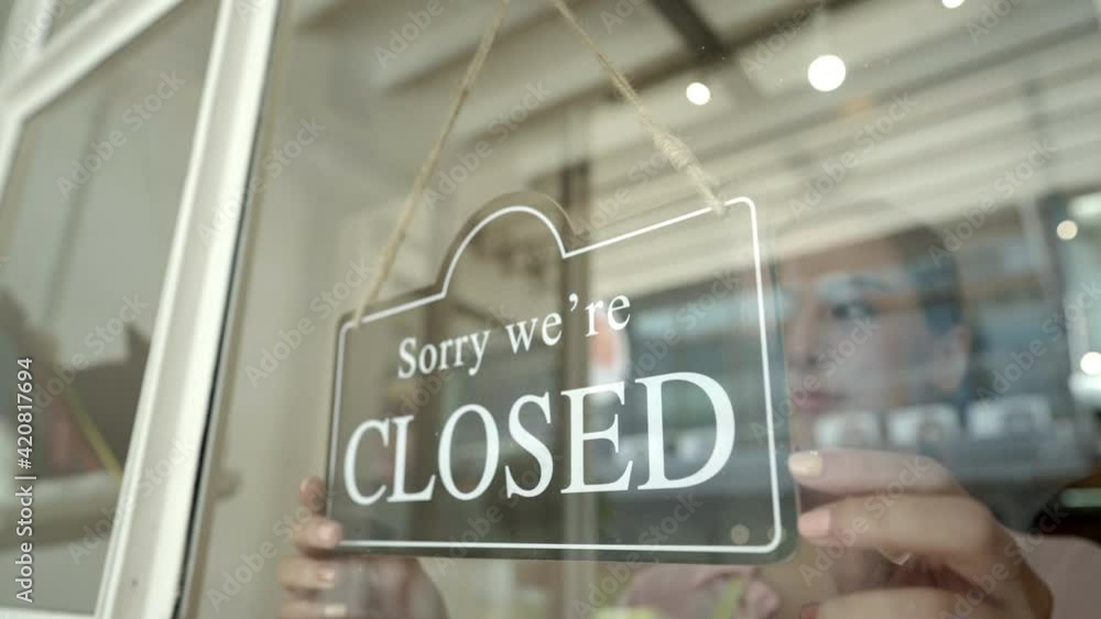 coffee shop owner flipping open sign board at front door ready to ...