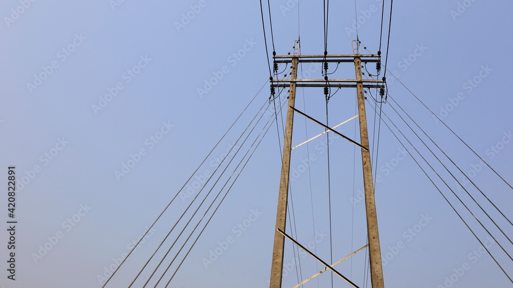 High-voltage lines on poles. Double concrete poles with power ...