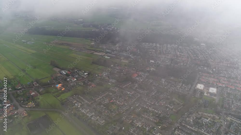 High altitude aerial footage moving through thick clouds showing ...