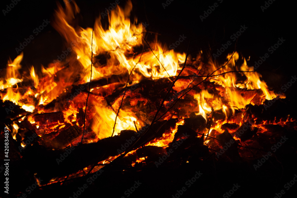 Burning bonfire on Novruz. Firewoods on fire. A dying fire. A bright ...