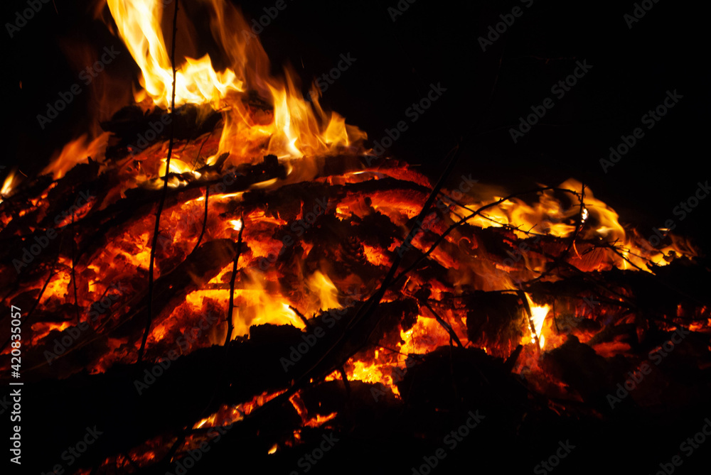 Burning bonfire on Novruz. Firewoods on fire. A dying fire. A bright ...