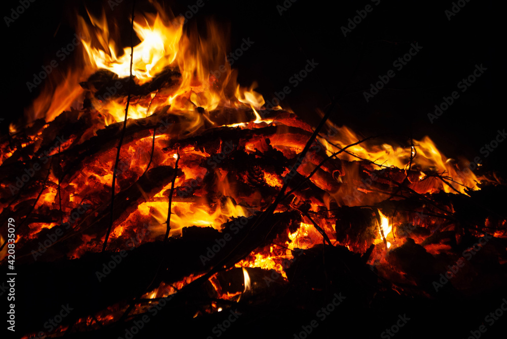 Burning bonfire on Novruz. Firewoods on fire. A dying fire. A bright ...