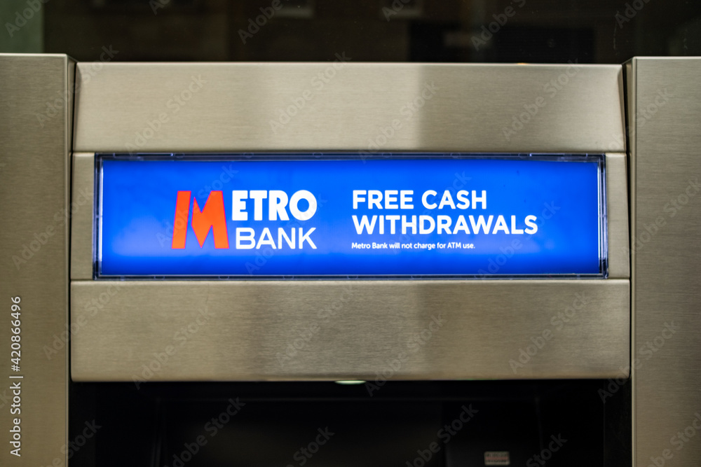 London- Metro Bank cash machine- a British high street retail ...