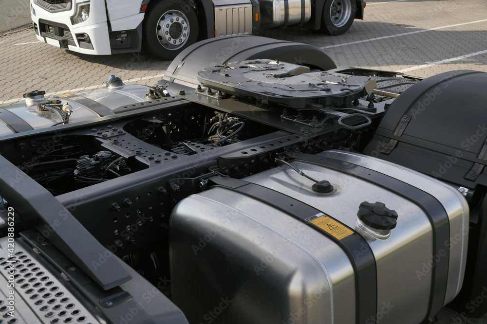 Rear of the tractor unit. Visible fifth wheel couplings are fitted to a ...