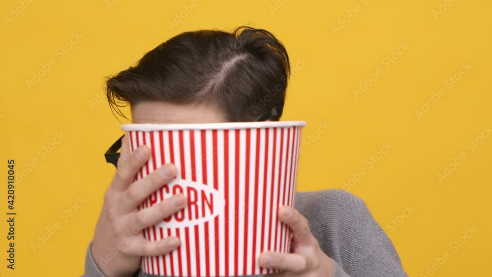 Boy Watching Horror Movie Hiding Behind Popcorn Bucket, Yellow ...