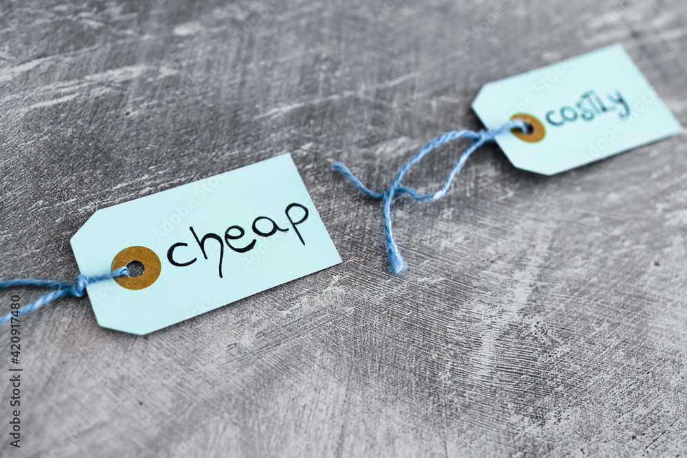 Cheap vs Costly prioduct price tags next to each other symbol of ...