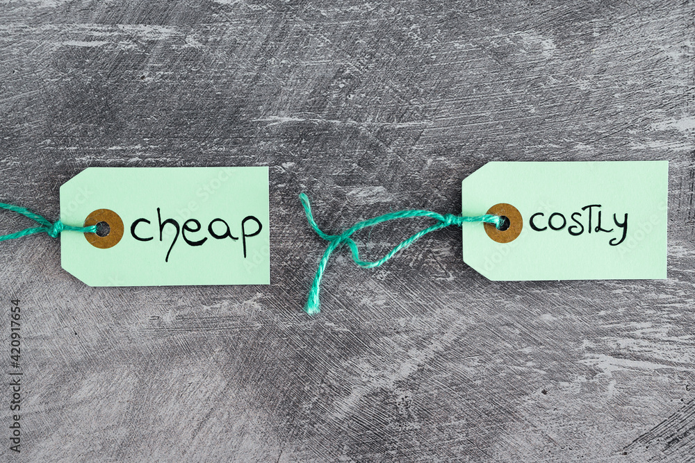 Cheap vs Costly prioduct price tags next to each other symbol of ...