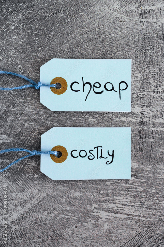 Cheap vs Costly prioduct price tags next to each other symbol of options for the customer, money ...