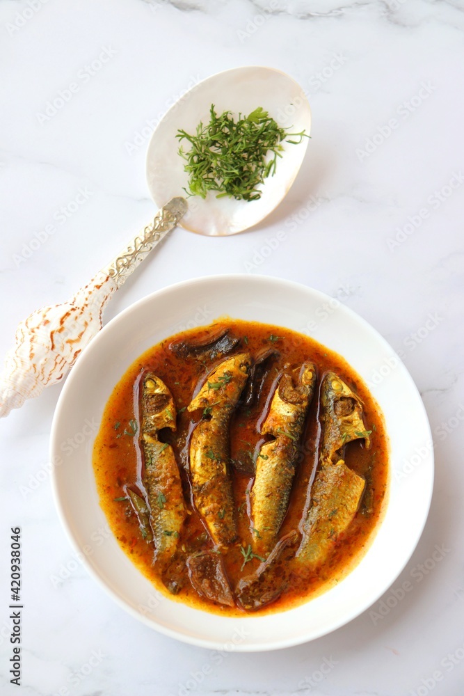 Indian fish curry. White Mullet fish curry made with dried mango and ...