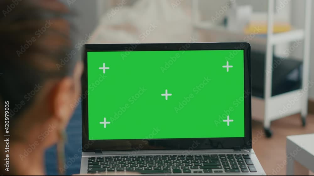 Close up of laptop computer with mock up green screen chroma key ...