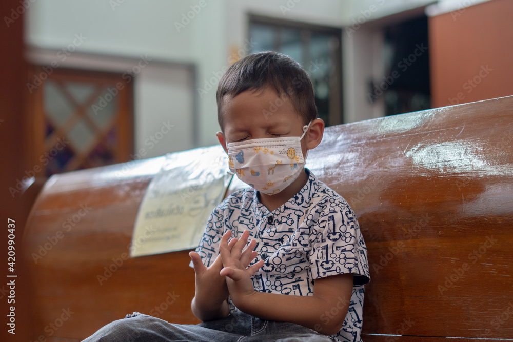 Little Christian Asian Boy is Sitting and Praying to God in Worship ...