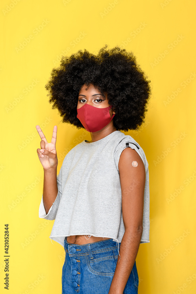 teenage girl shows vaccine mark on her arm during covid-19 coronavirus ...