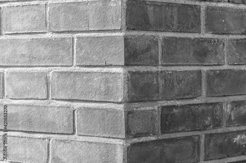 exterior corner of brick wall on black and white background Stock Photo ...