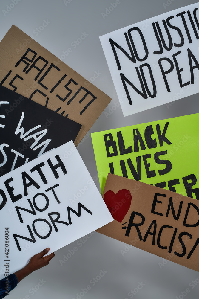 Posters with anti racist phrases on light background Stock Photo ...