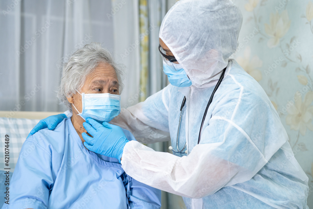 Asian doctor wearing face shield and PPE suit new normal to check ...