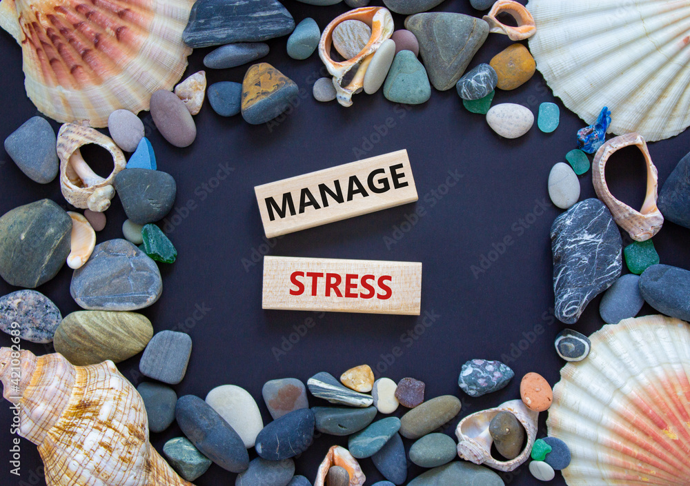 Manage stress and be health symbol. Wooden blocks with words 'manage ...
