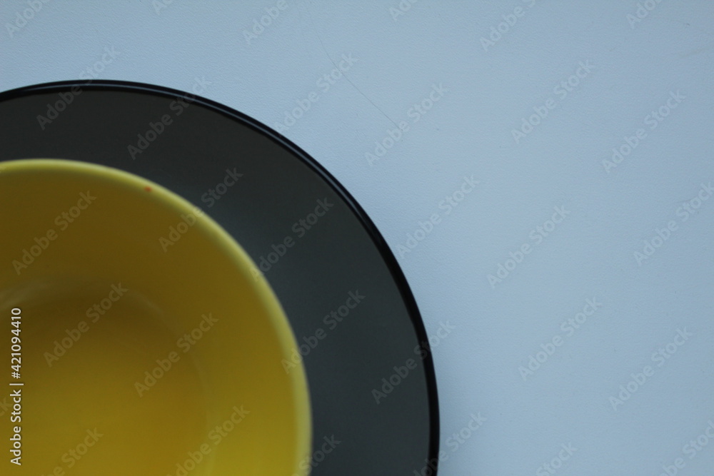 plates of yellow gray on a light white background with a ist for text ...