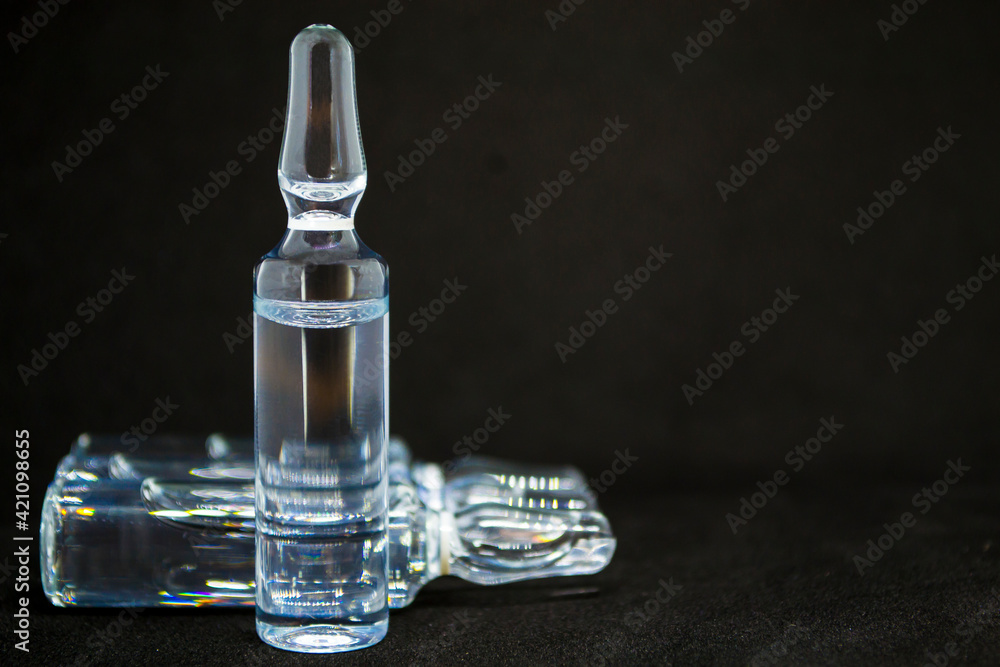 Glass medical ampoule vial for injection. Medicine is liquid sodium ...