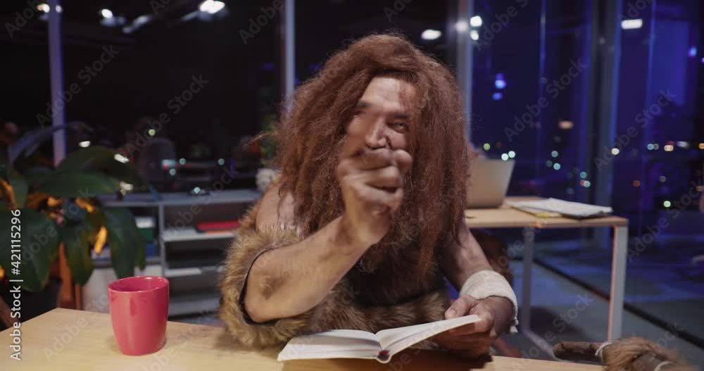 Video Stock Portrait face of caveman in furry clothes yelling at camera ...