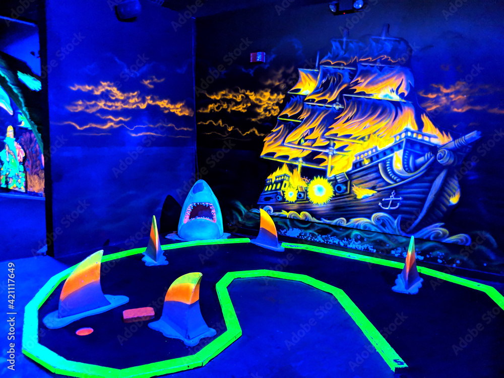 Neon Pirate Ship and Shark Mini Golf Course Stock Photo | Adobe Stock