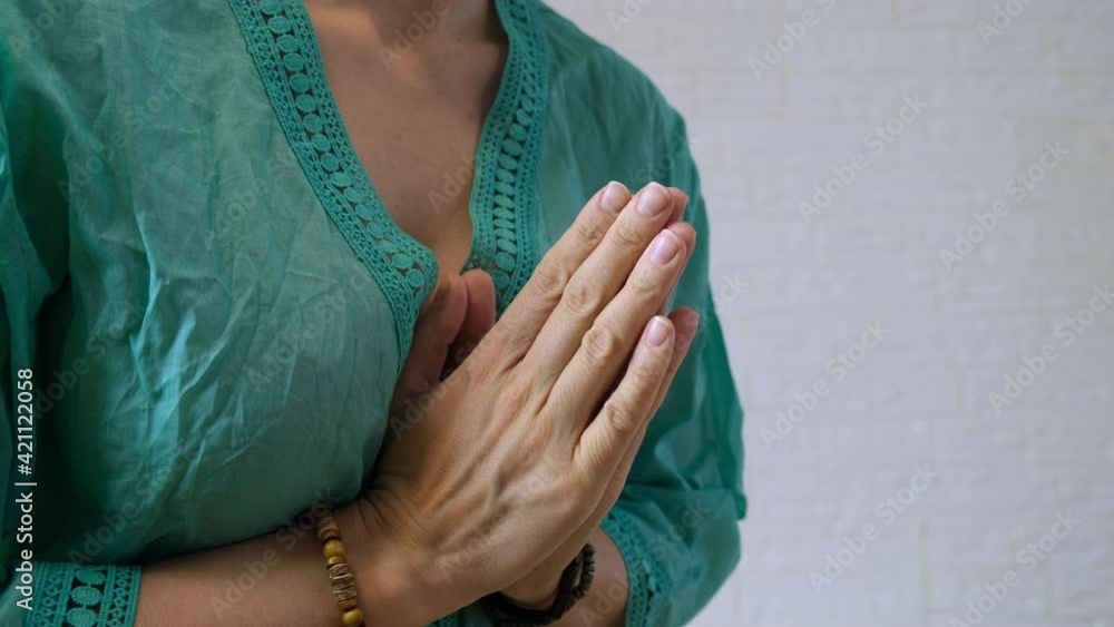 Woman ethnic clothes hold hands together is symbol prayer and gratitude ...