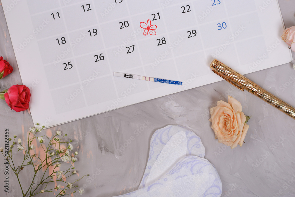 Periods calendar for checking menstruation days on stone background ...