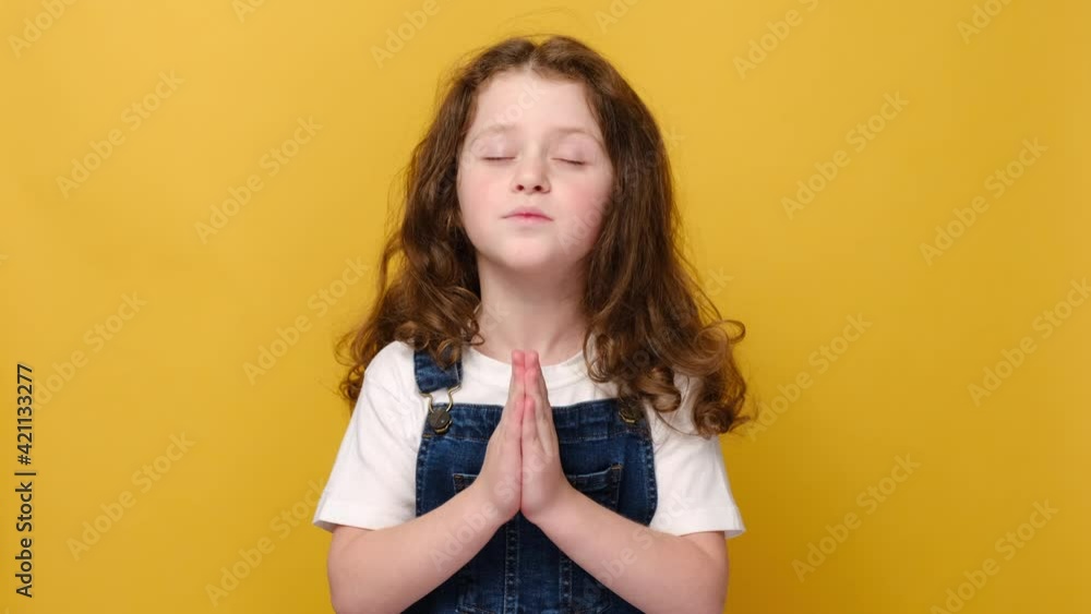 Video Stock Hopeful cute little girl kid keep hands in prayer hope ...
