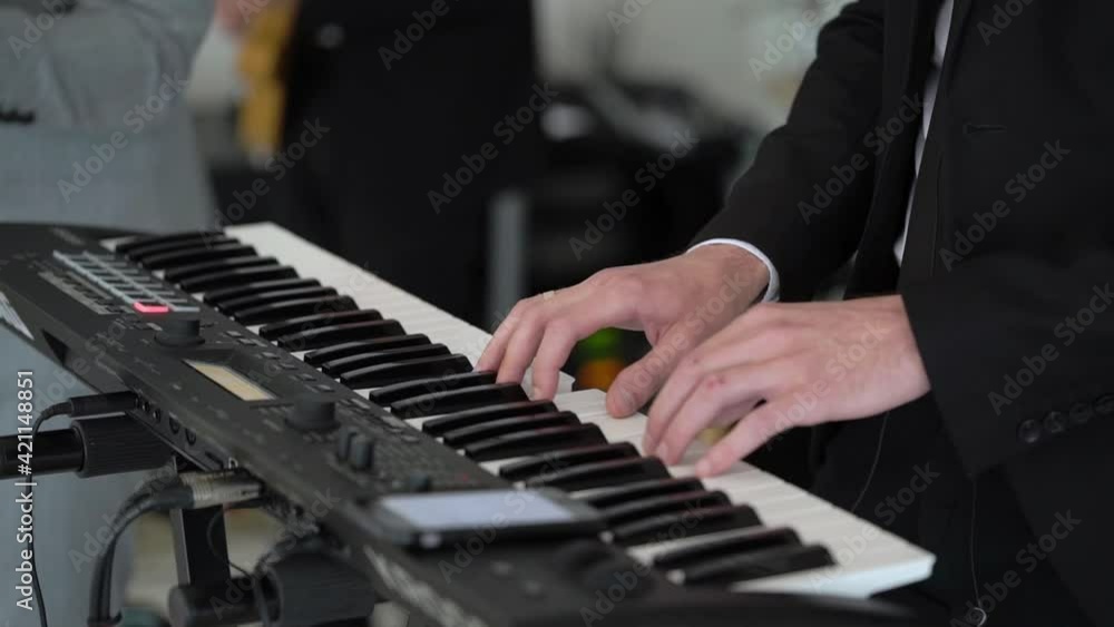 Man playing electronic piano, musician at concert midi keyboard, band ...