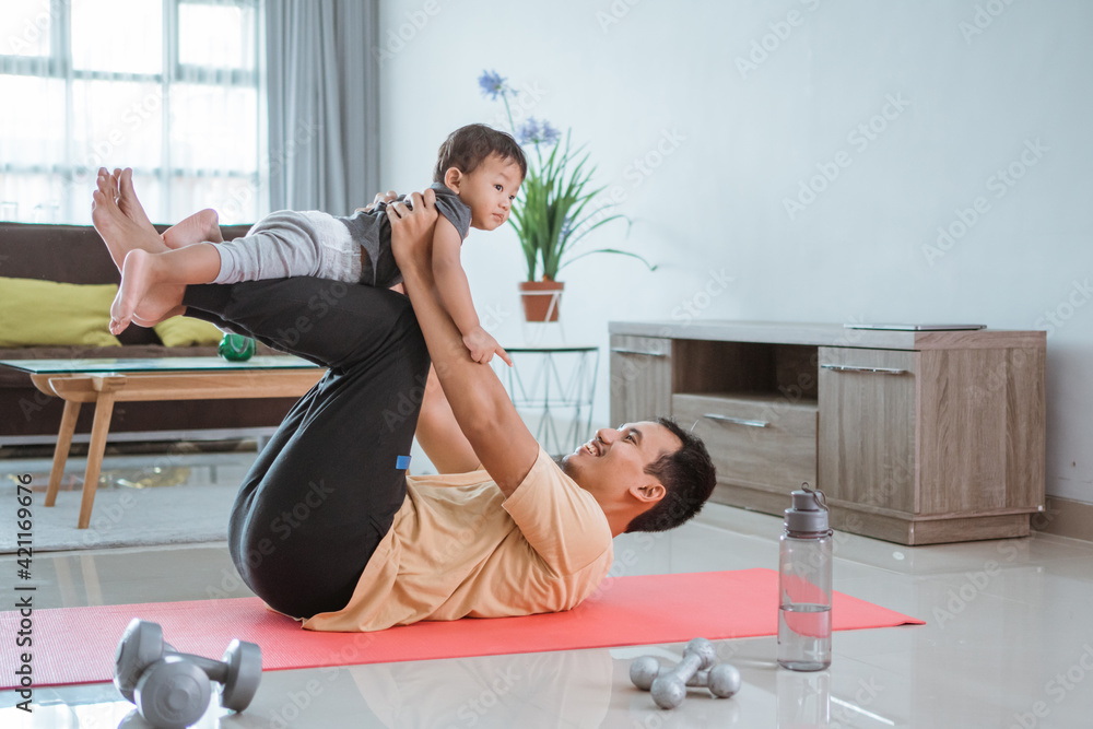 happy father and kid doing exercise together. portrait of healthy ...