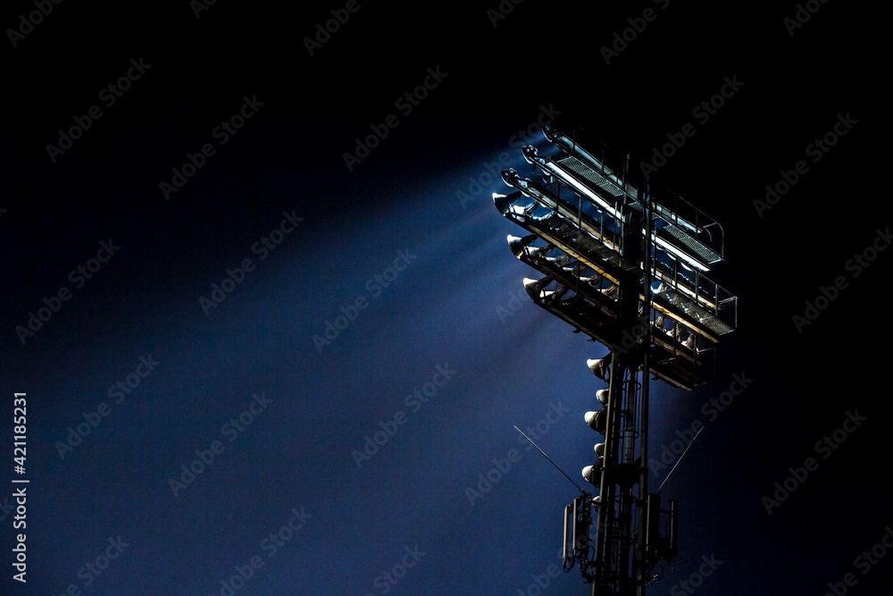 Lights at night. Spotlight illuminates the field at the sports stadium ...