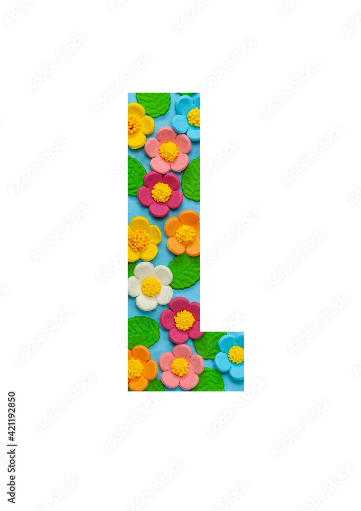 The letters L of the English alphabet is cut out of flowers on a blue ...