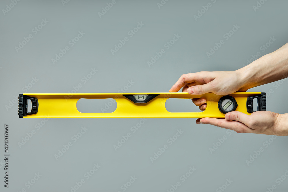 yellow spirit level, bubble level designed to indicate whether a ...